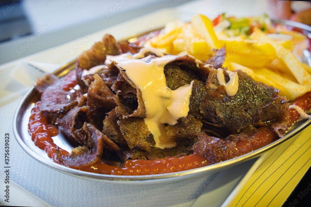 Traditional Bosnian street food - doner kebab with french fries and ...