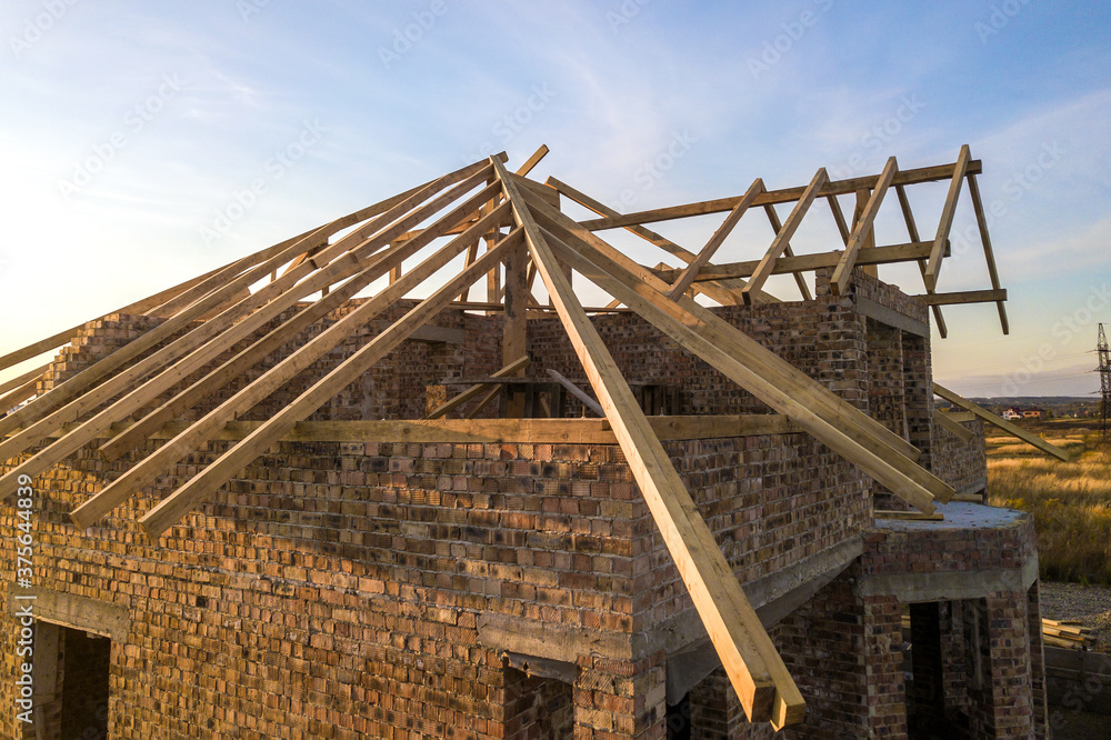 Private residential house with wooden roof frame structure under ...