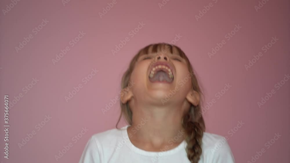 Child Shouting Loud on a pink background. Portrait of Shocked, Angry ...