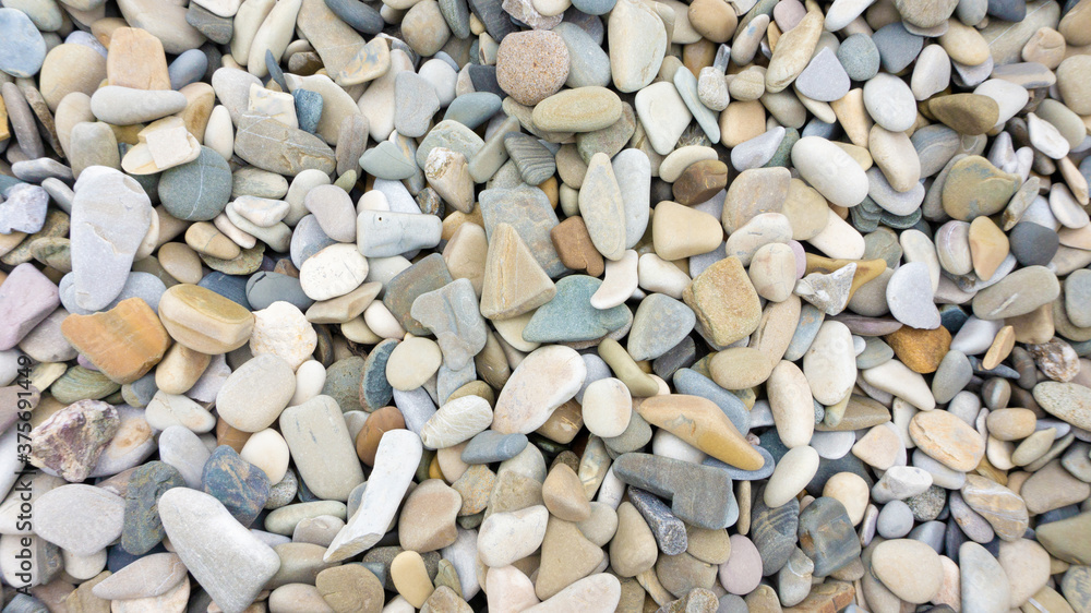 Mosaic sea pebbles background. Texture of small marine multi-colored ...