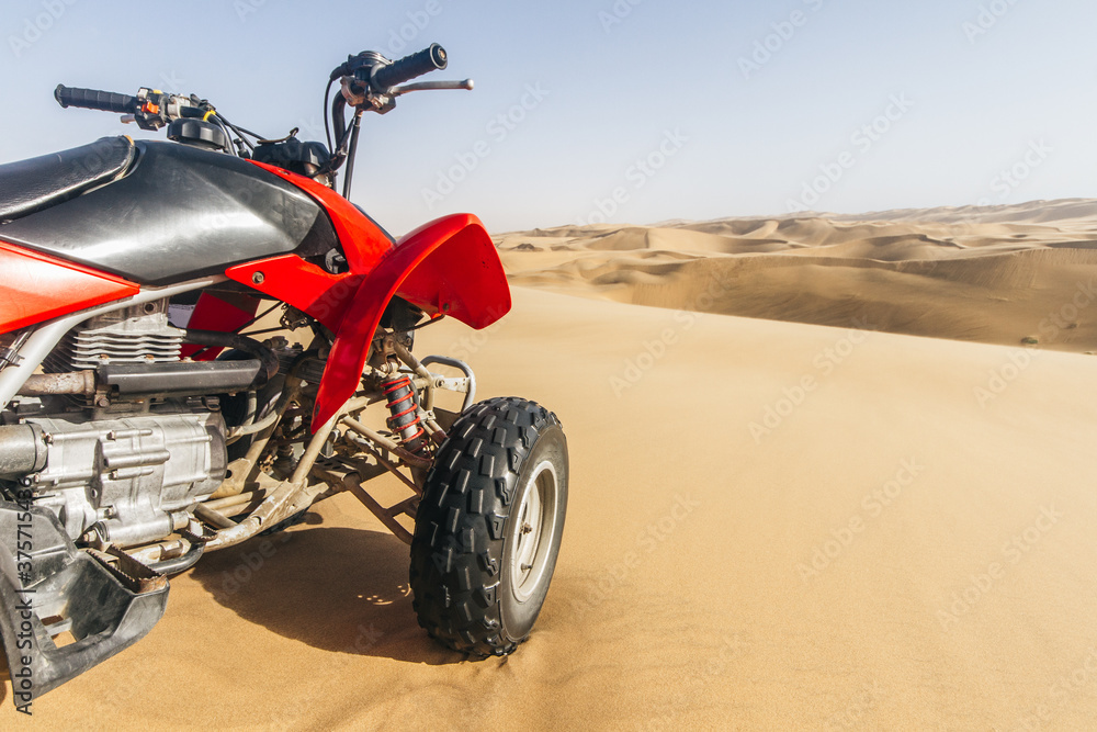 ATV - Quad bike on desert dunes landscape Stock Photo | Adobe Stock