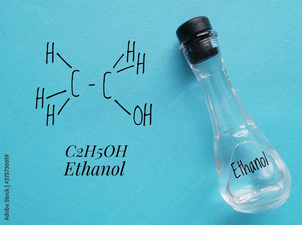 Structural chemical formula of ethanol molecule with a glass bottle of ...