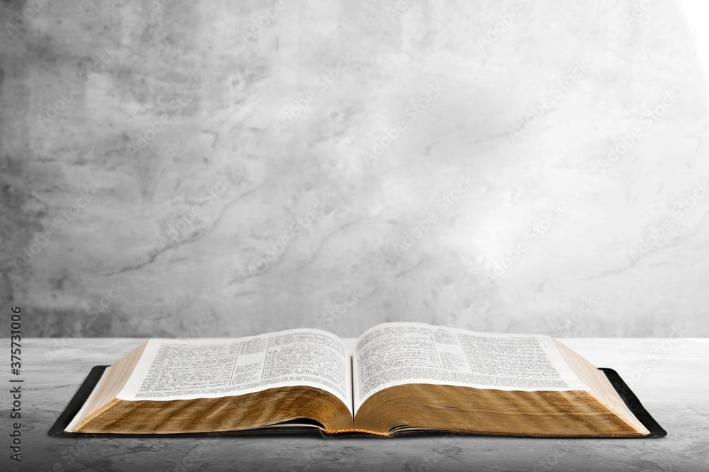 Open vintage christian bible on desk Stock Photo | Adobe Stock