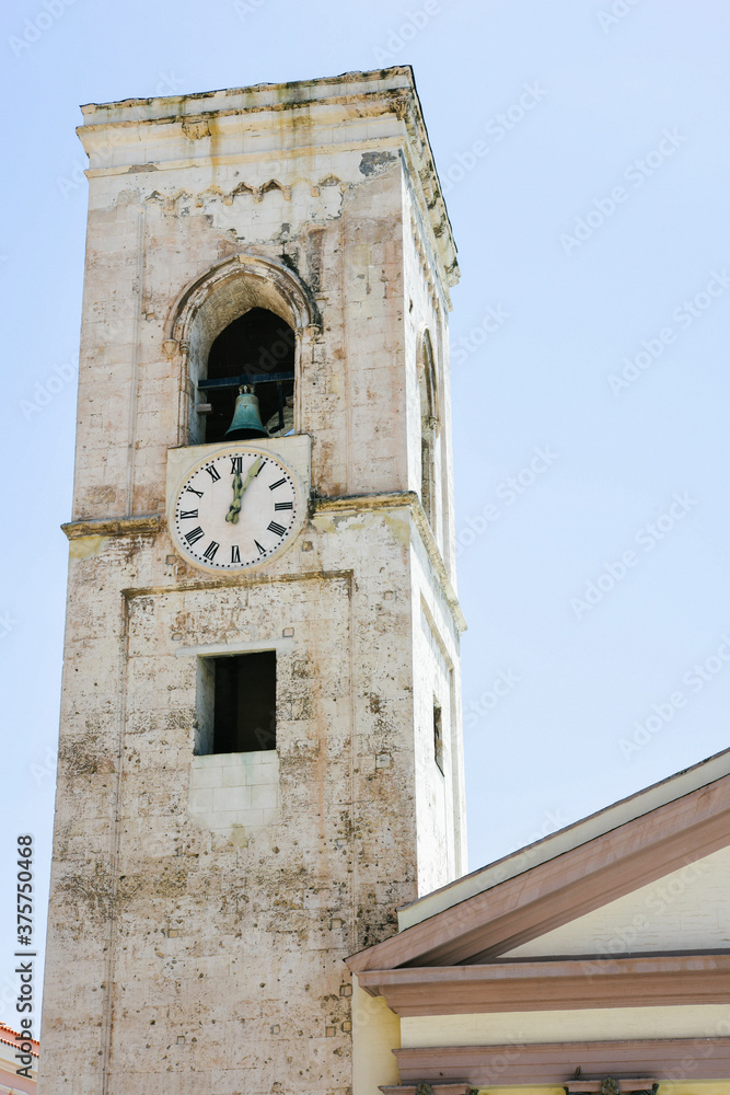Ancient tower clock on the outside of a medieval church Stock Photo ...