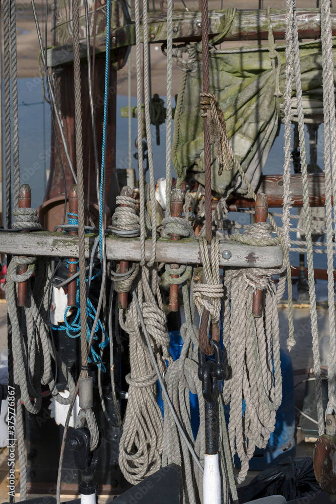 Ropes and knots on the side of a fully rigged old sailing ship Stock ...
