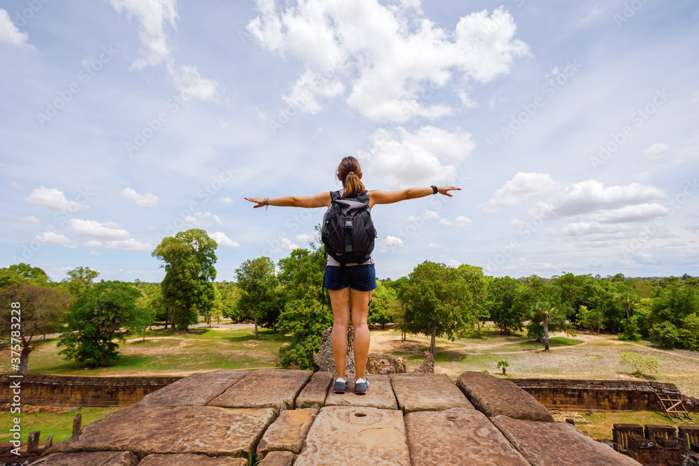 Back view of a female tourist on the top of the Pre Rup temple. Stock ...