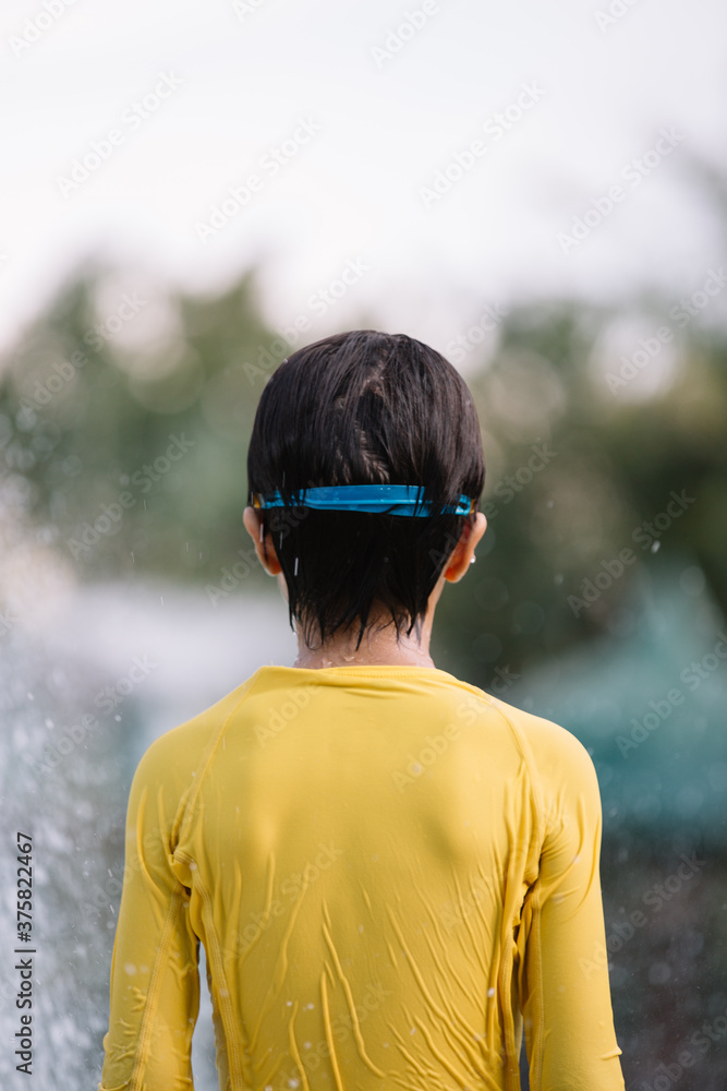 Young boy getting ready to dive into the swimming pool Stock Photo ...