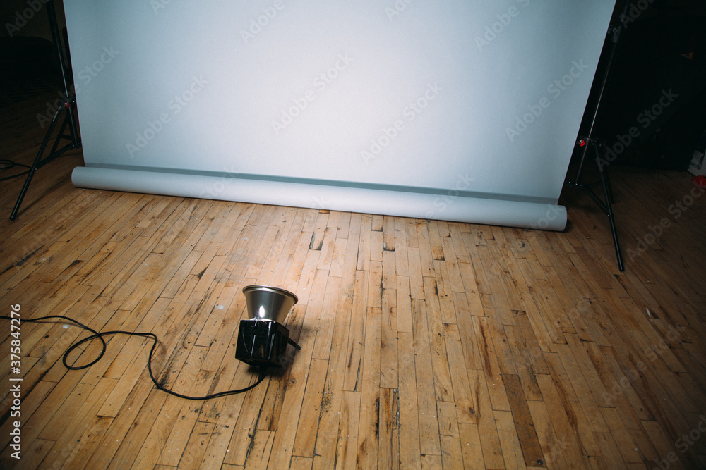 Snapshot of a strobe light on the studio floor Stock Photo | Adobe Stock