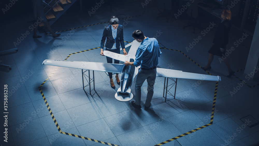 Team of Industrial Aerospace Engineers Work On Unmanned Aerial Vehicle ...