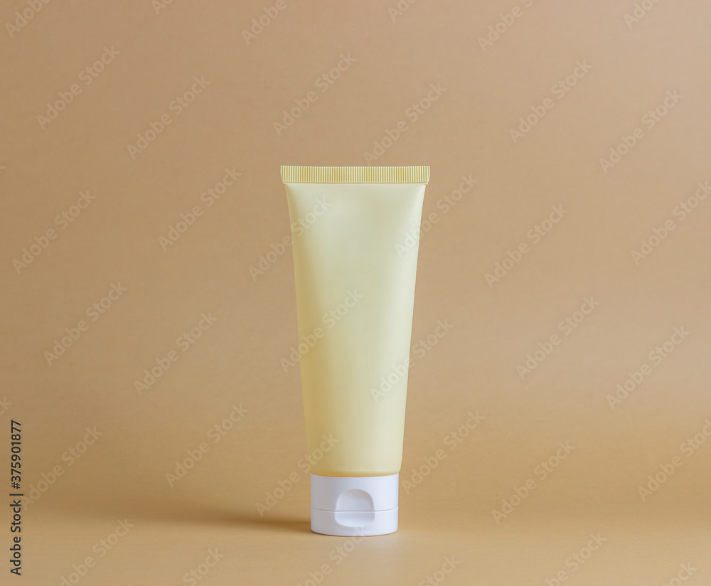 Cosmetic cream in a tube on a beige background. Natural cosmetics ...