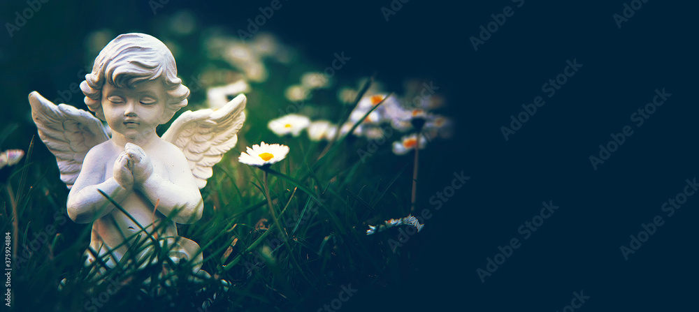 Guardian angel kneeling and praying Stock Photo | Adobe Stock