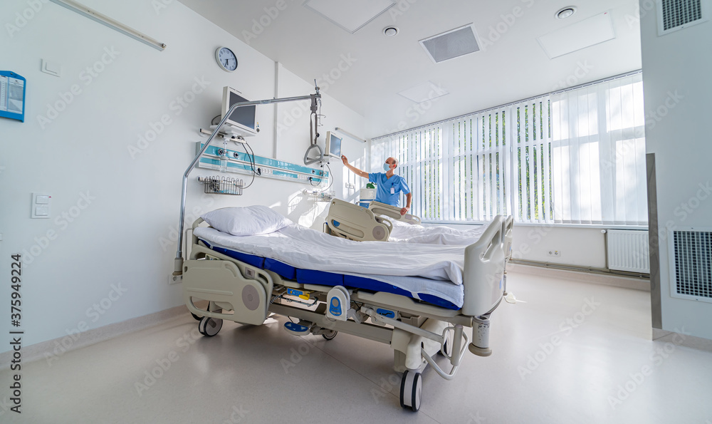 Modern chamber in present clinic. Medical bed and a special device in ...