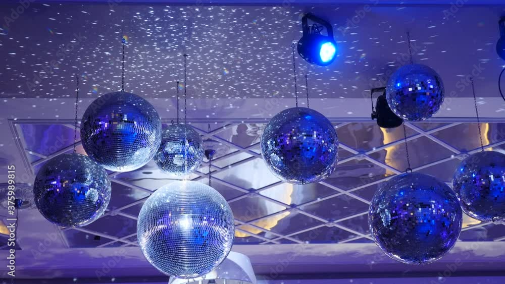 Night disco party concept. Light music disco ball on blue background ...