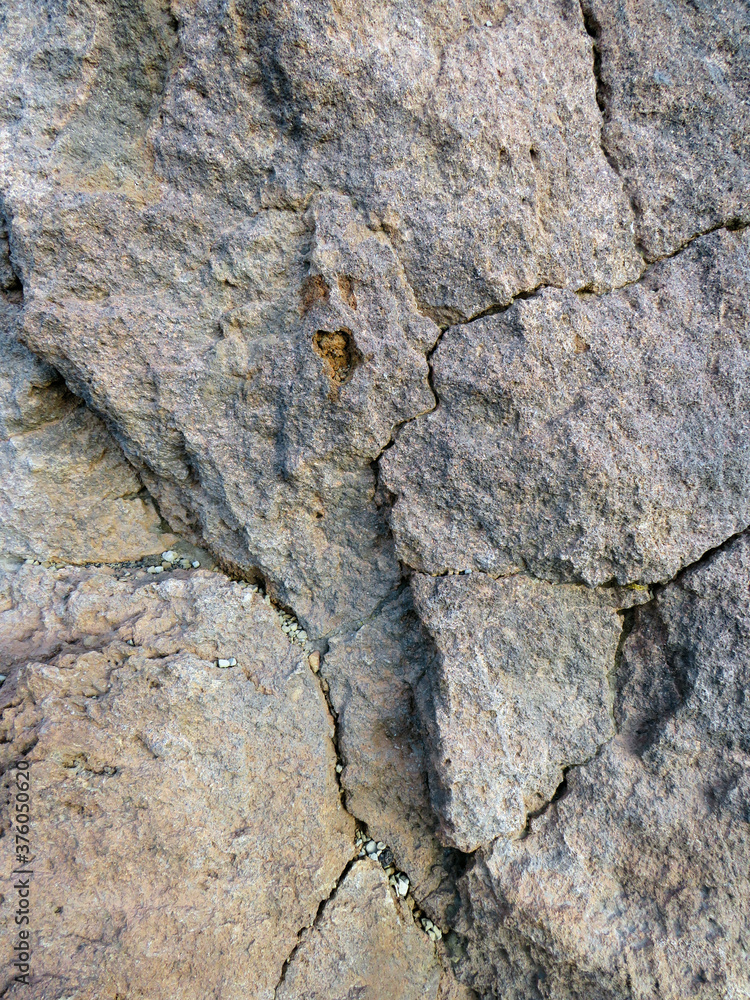 Cracked volcanic rock background. Surface of fissured quartzite stone ... Cracked volcanic rock background. Surface of fissured quartzite stone ...
