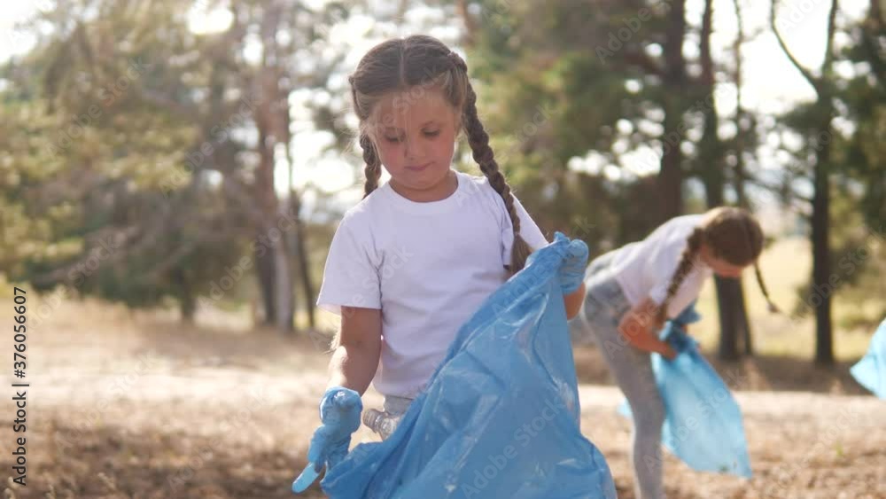 kid collecting trash volunteer teamwork. child group happy family on ...