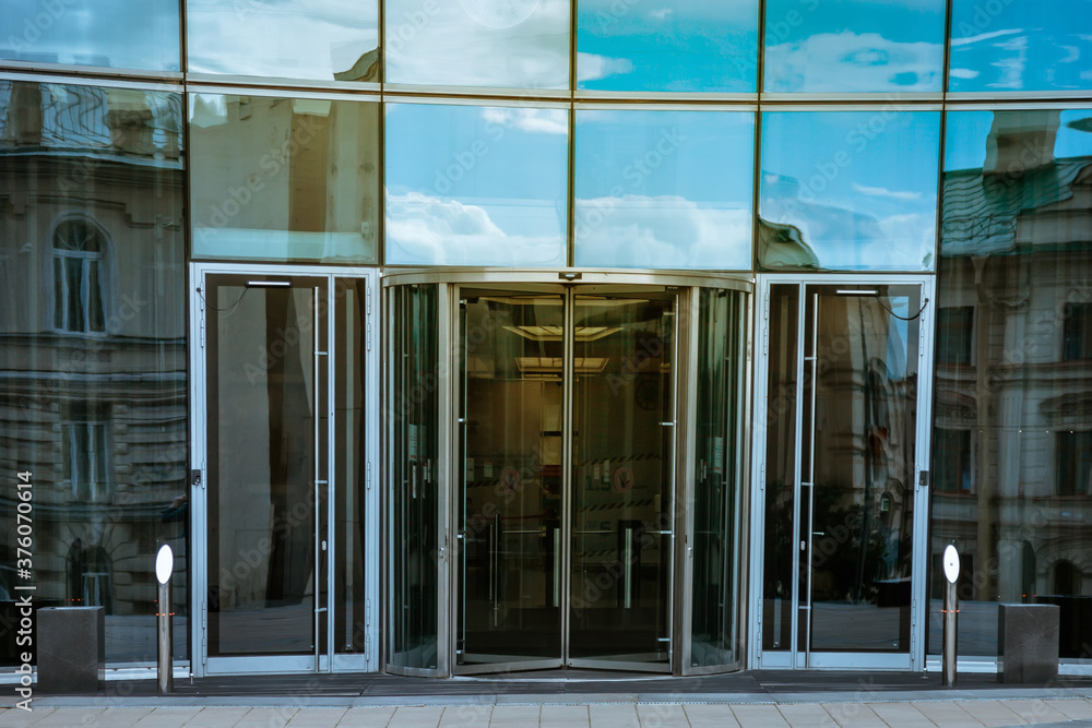 Entrance to modern office building of business city with automatic ...
