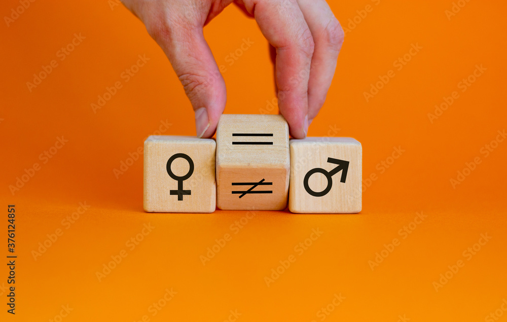 Symbol for gender equality. Hand turns a cube and changes a unequal ...