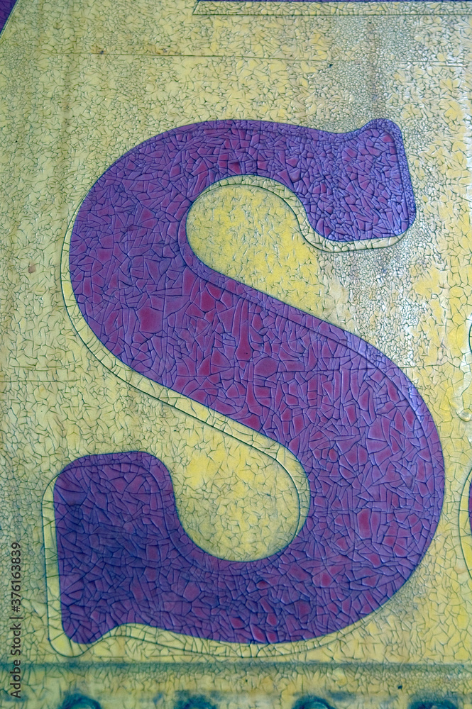 Old, faded, worn and used letters, alpha numeric set character that ...