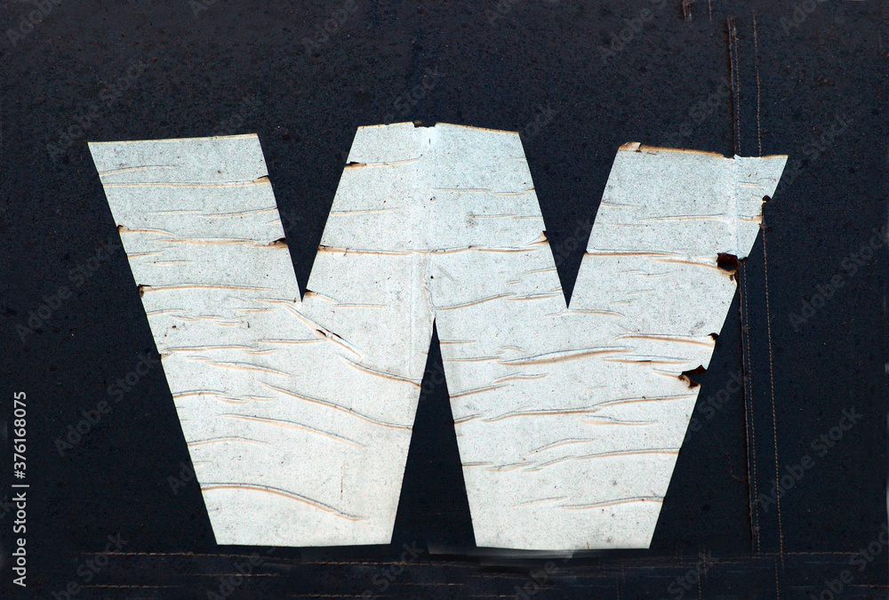 Old, faded, worn and used letters, alpha numeric set character that ...