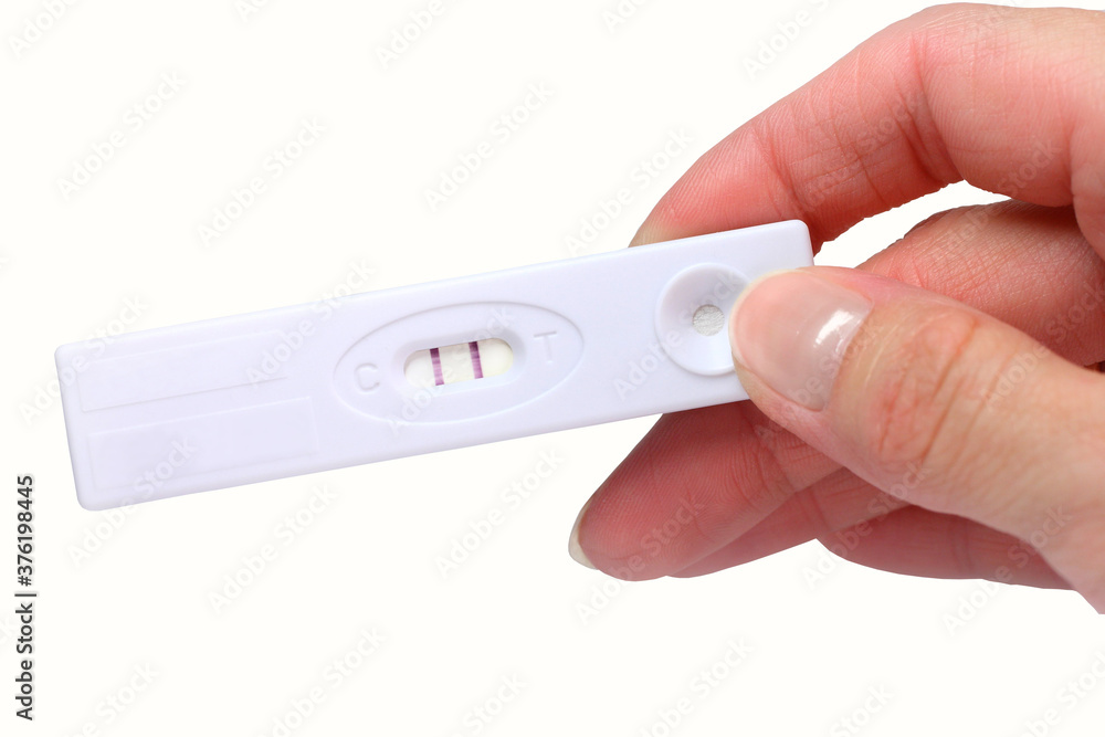 Modern pregnancy test Positive. Pregnancy quick test isolated. A woman ...
