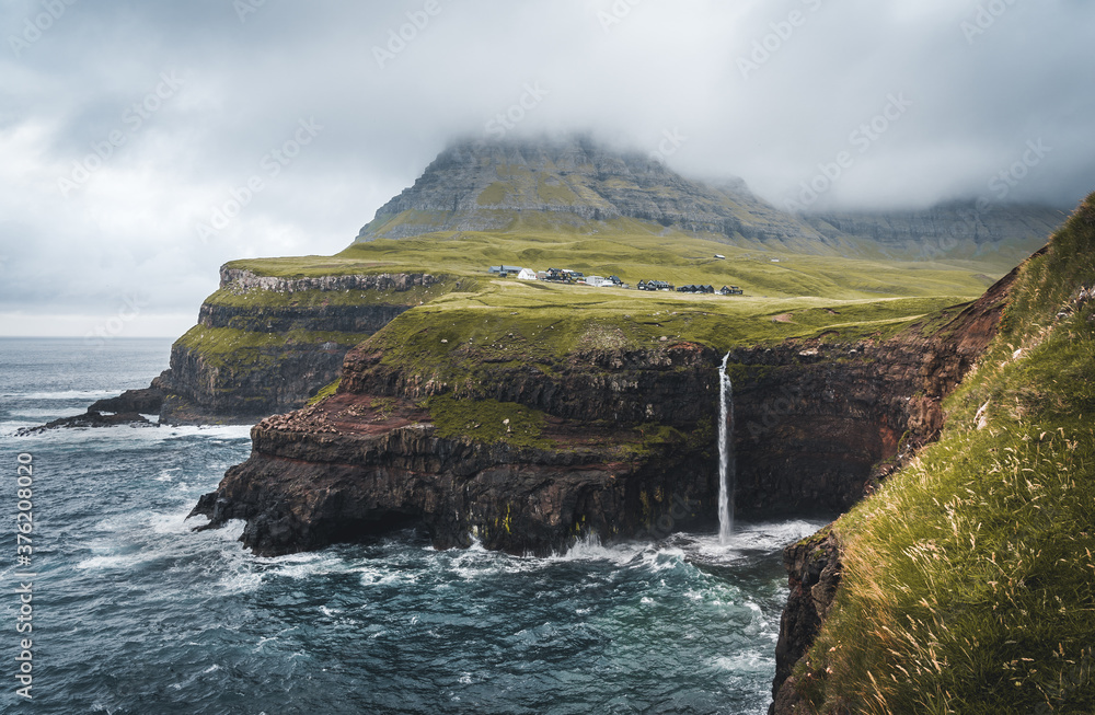 Gasadalur village and Mulafossur its iconic waterfall, Vagar, Faroe ...