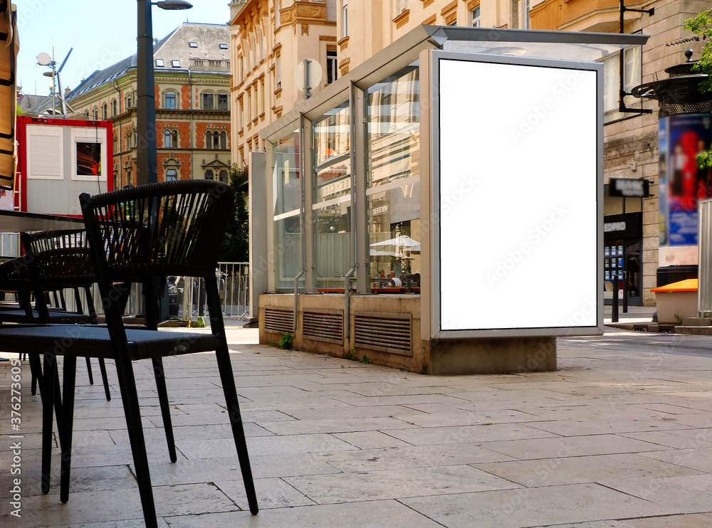bus shelter and bus stop along urban street. glass and aluminum ...