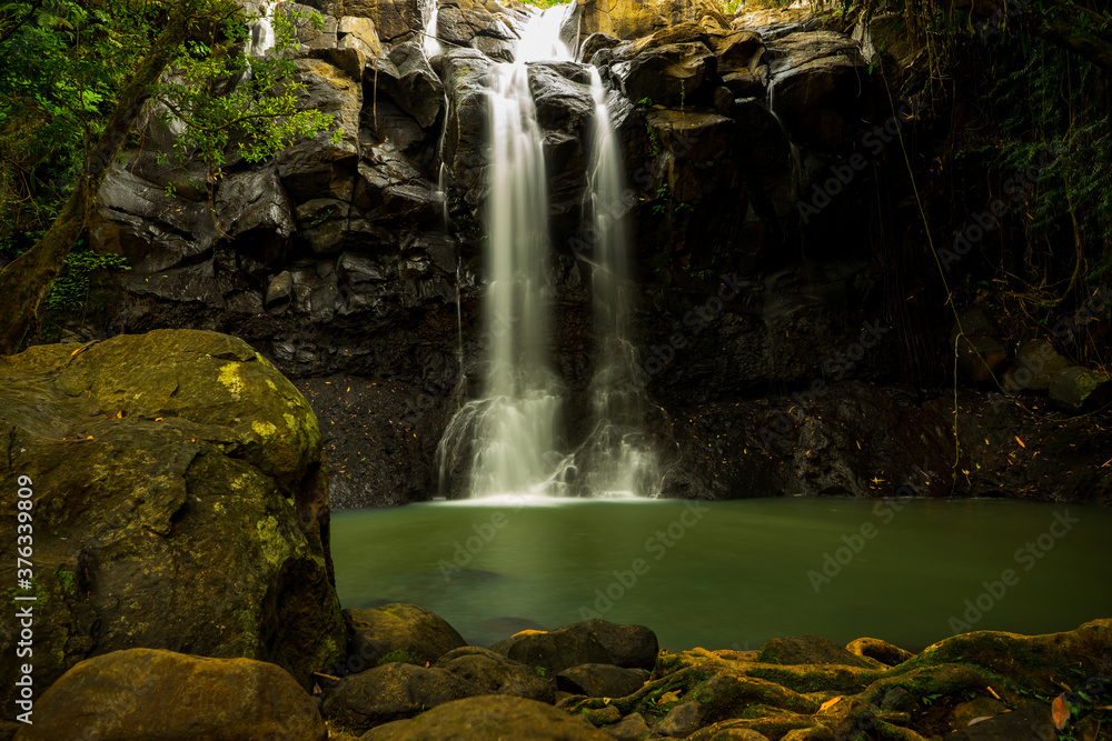 Waterfall landscape. Beautiful hidden waterfall in tropical rainforest ...