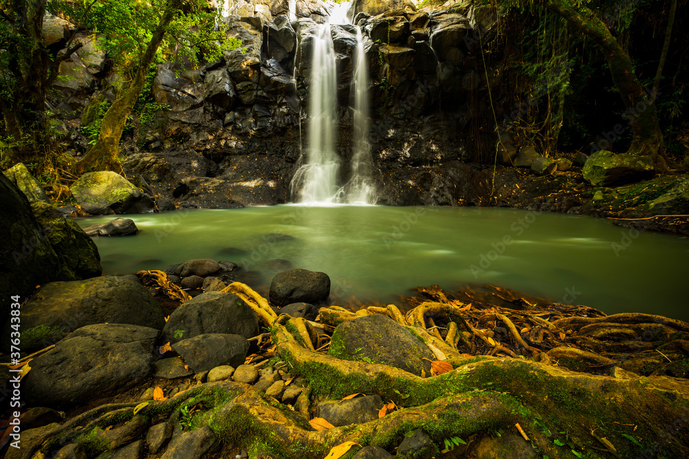 Waterfall landscape. Beautiful hidden waterfall in tropical rainforest ...