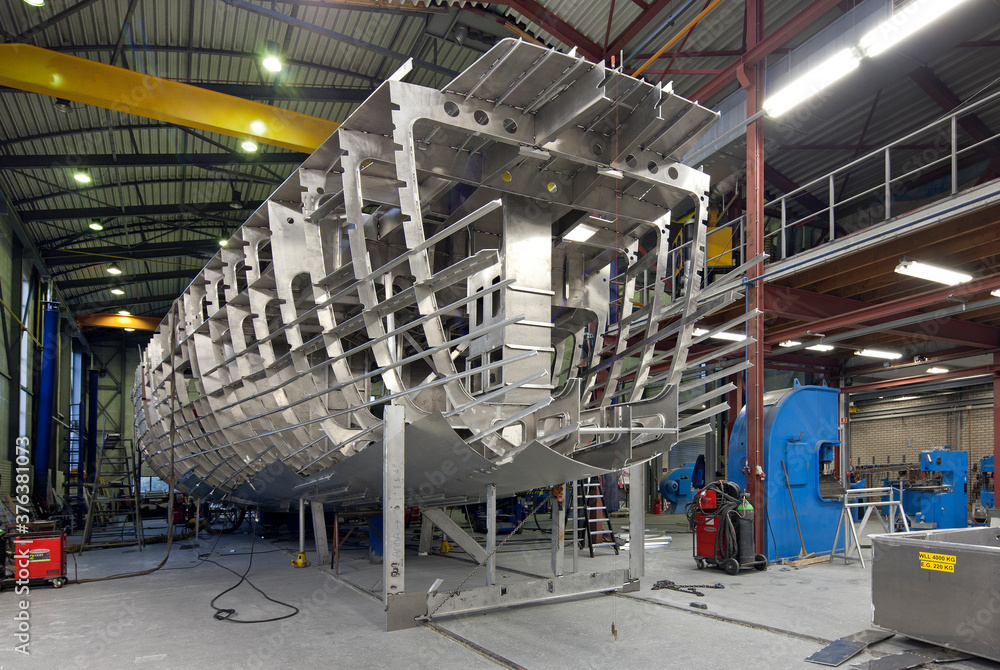 Aluminium hull of a yacht at the shipyard. Airframe. Ship building ...