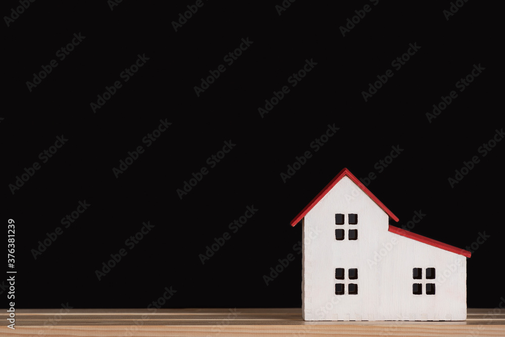 Model house on black background. Property, private house, sale ...