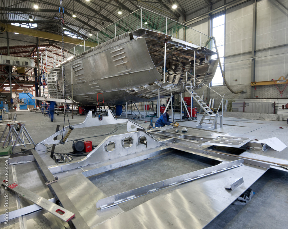 Aluminium hull of a yacht at the shipyard. Airframe. Ship building ...