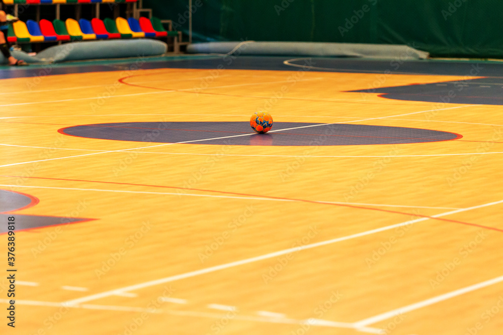 Gym for playing futsal, mini-football. Folded wooden parquet on the ...