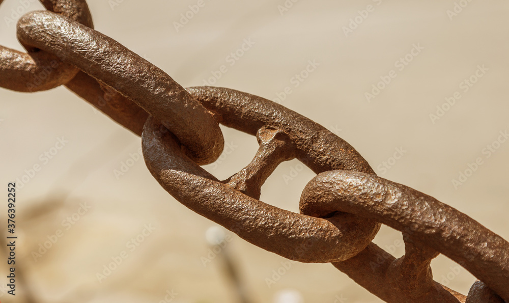 The old rusty metal chain of the anchor of the ship. Giant heavy steel ...