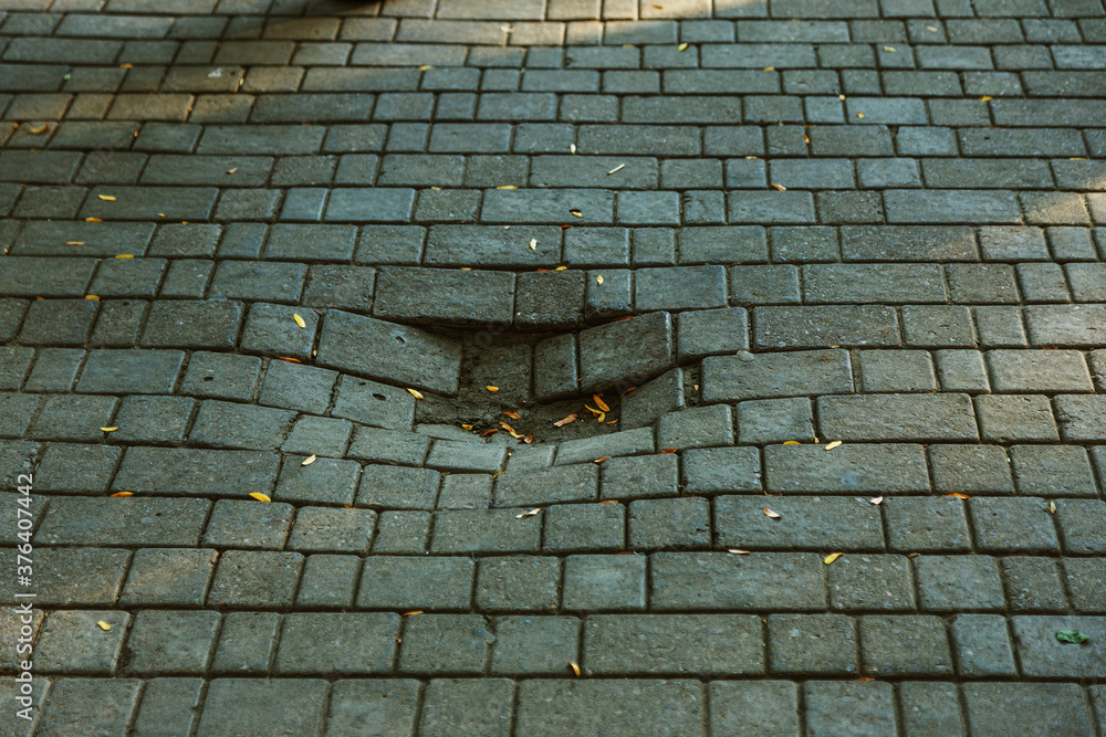 Damaged asphalt road with potholes, caused by freeze-thaw cycles in ...