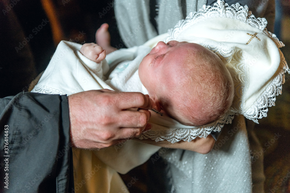 christening of the infant Stock Photo | Adobe Stock