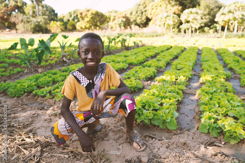 Little Black African Boy Child Smiling in front of Agricultural Camp in ...