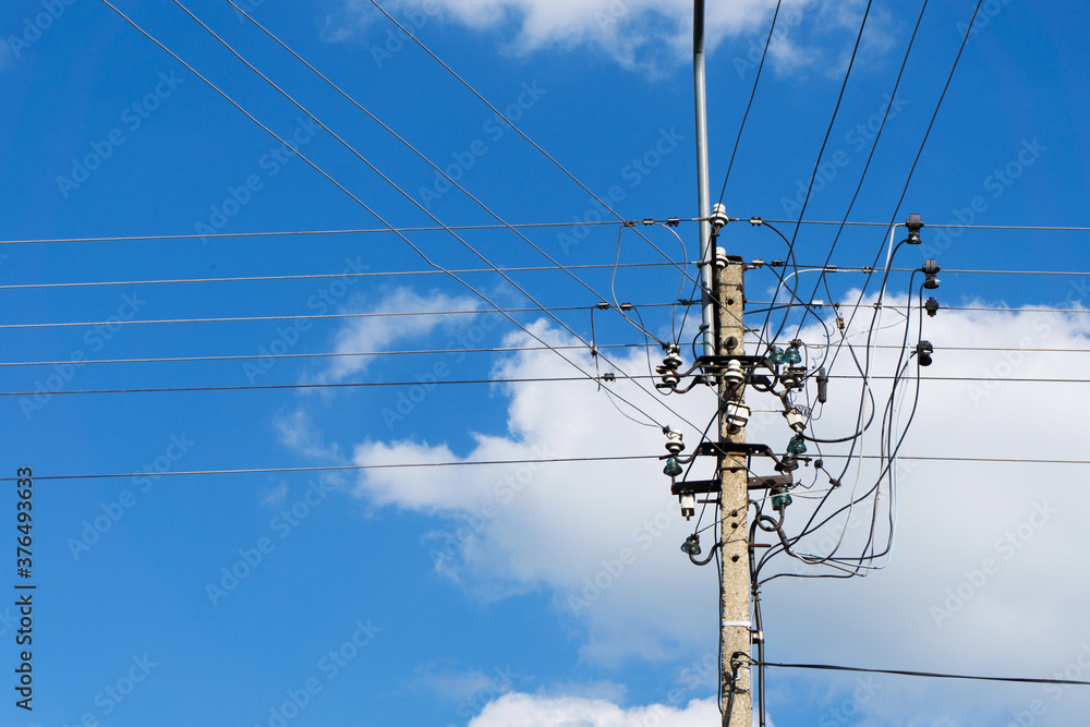 Energy transfer lines in Poland. Low voltage pole background. Small ...