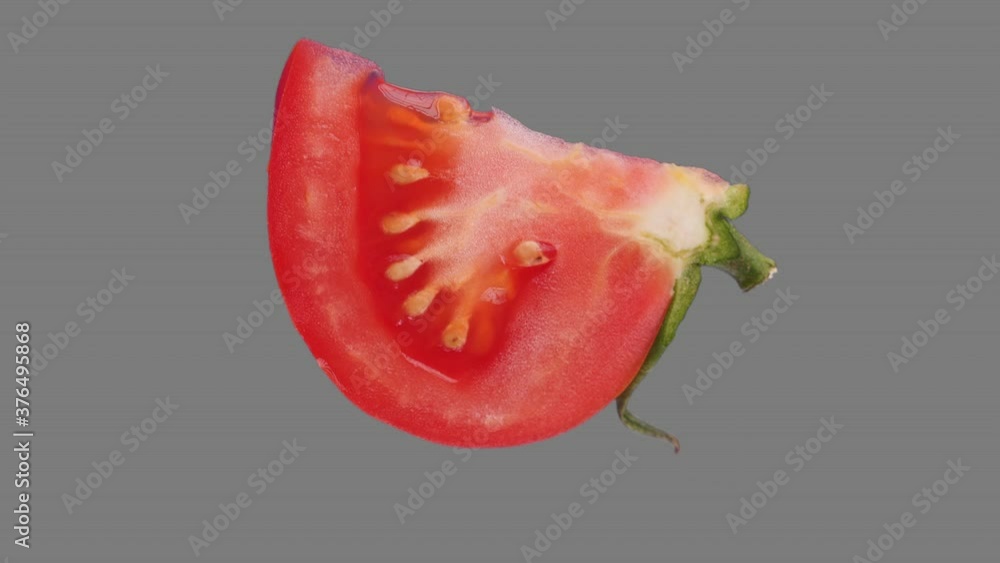 Fresh tomato slice spin and float - isolated on neutral gray. Seamless ...