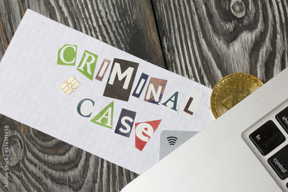 The phrase Criminal case made of letters cut from a magazine and pasted ...