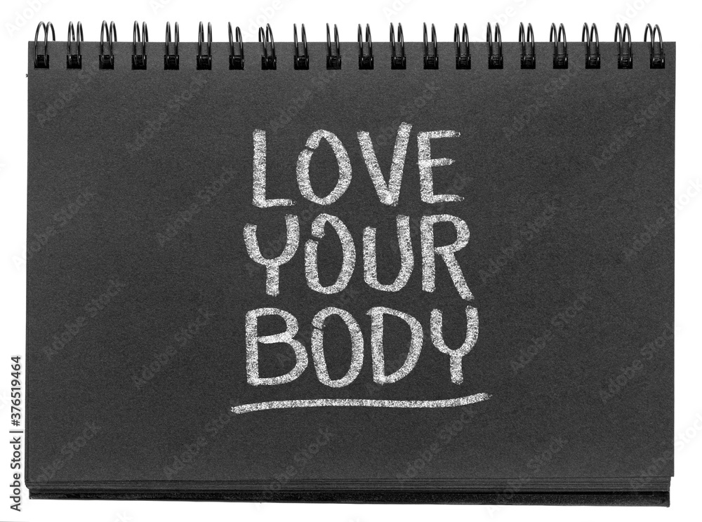 love your body - white chalk inspirational text in a black paper spiral ...