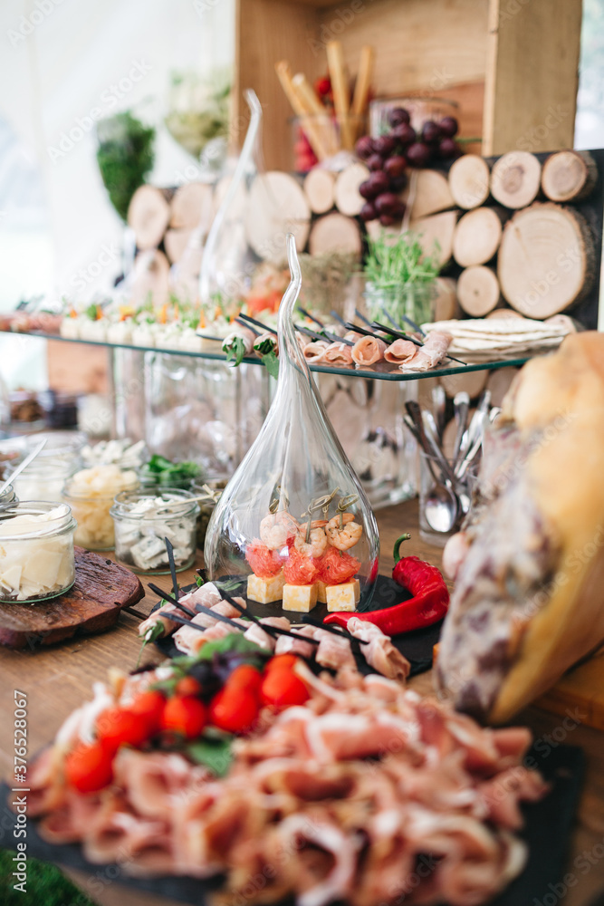 Front view of delicious snack bar on wedding celebration. Luxury table ...