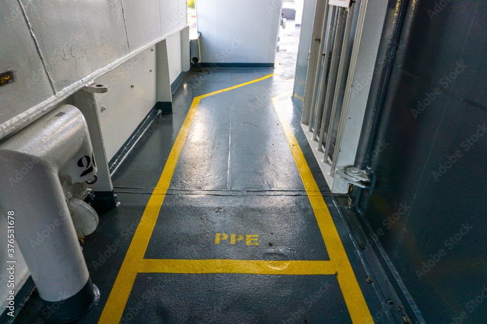 Safety walkway on ships deck. Yellow line walkway. Guided walkway on ...
