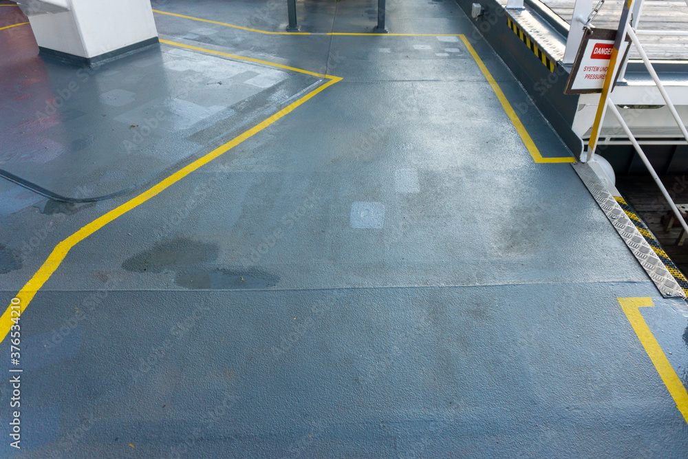 Safety walkway on ships deck. Yellow line walkway. Guided walkway on ...