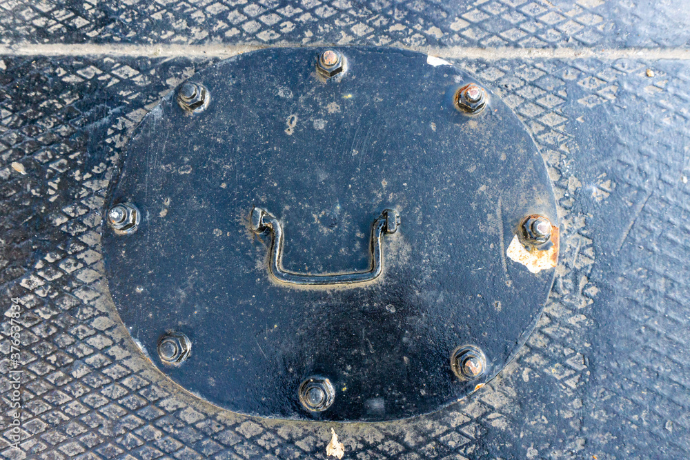 Closed tank lin on black barge. Confined space, manhole. Stock Photo ...