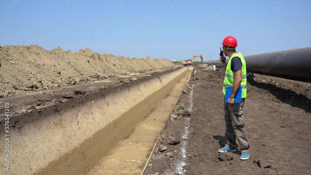 Construction Foreman Using Radio-Telecommunication Device at Pipeline ...
