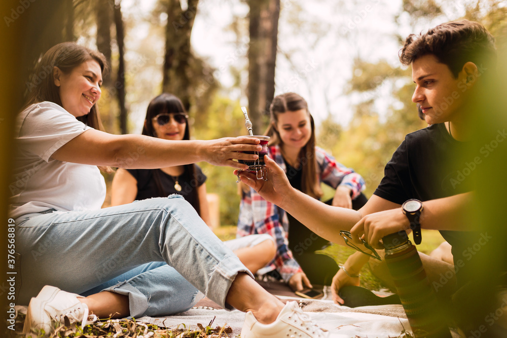 Foto de Happy friends drinking mate infusion. Lifestyle concept of ...