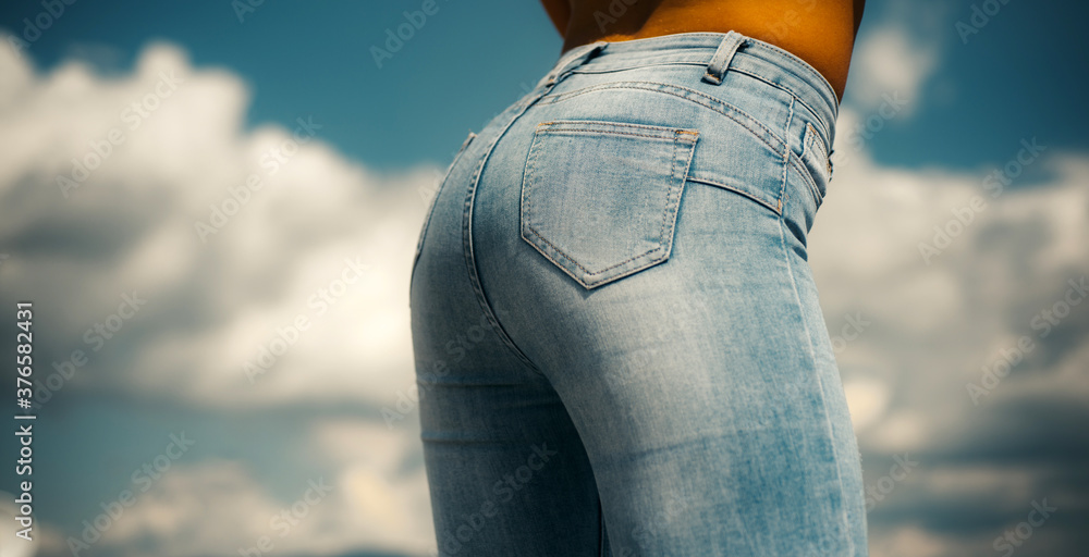 Woman wearing of jean pants from back. Female bottom in tight jeans ...