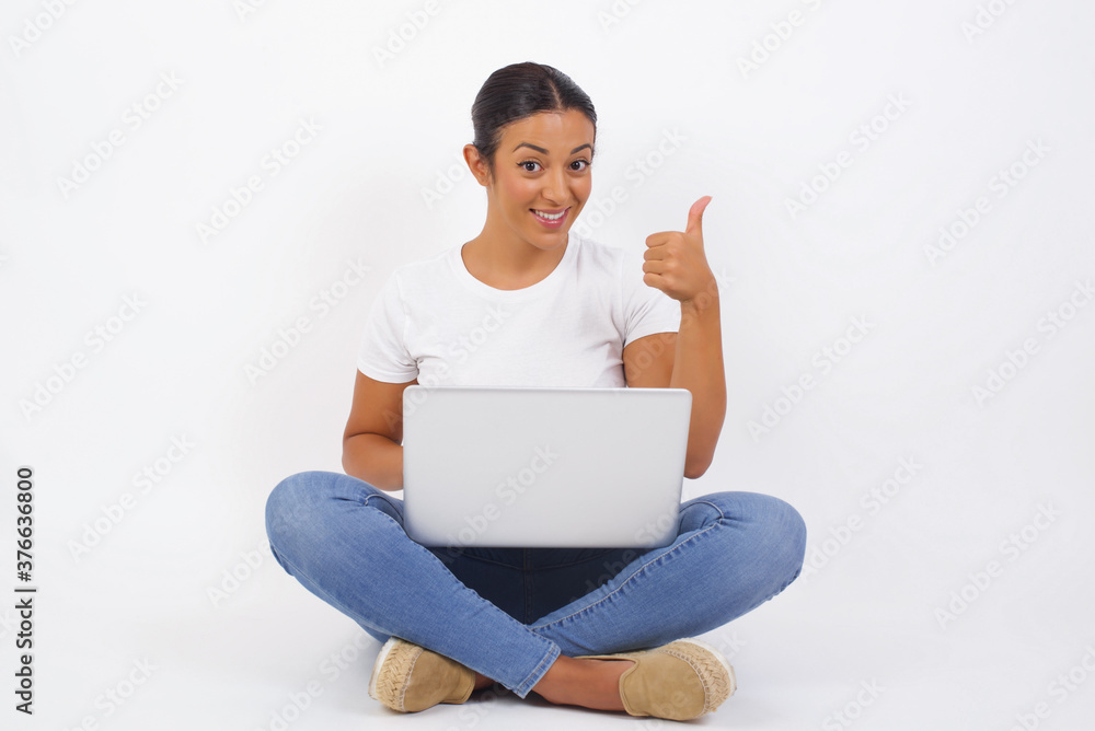 Good job! Portrait of a happy smiling blue eyed young successful woman ...