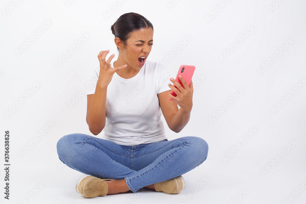 Excited woman showing smartohone blank screen, blinking eye and doing ...