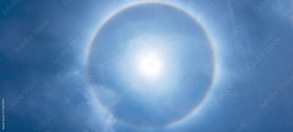 Beautiful sun halo phenomenon with circular rainbow, solar halo the ...